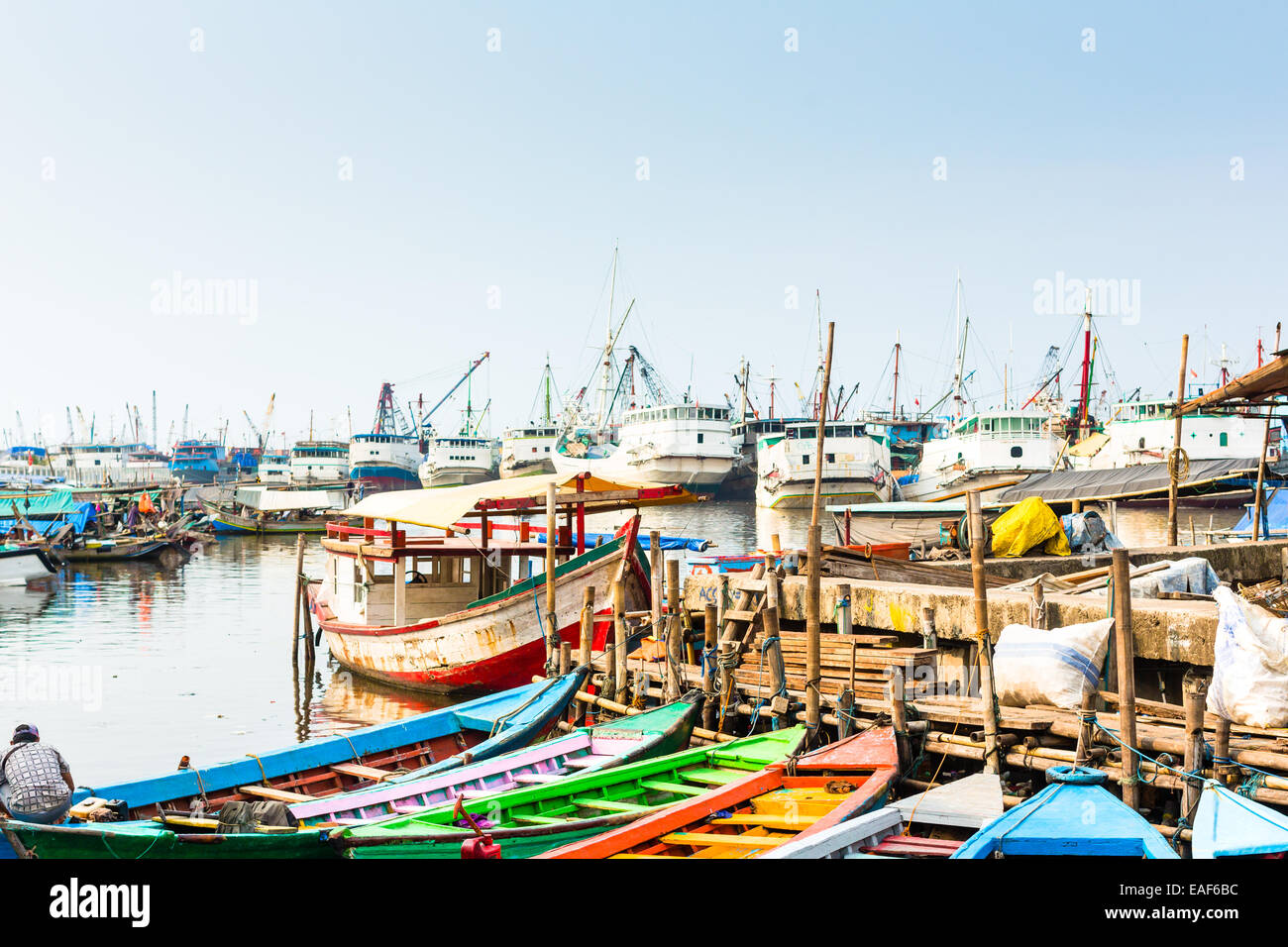 Sunda Kelapa old Harbour with fishing boats, ship and docks in Jakarta ...