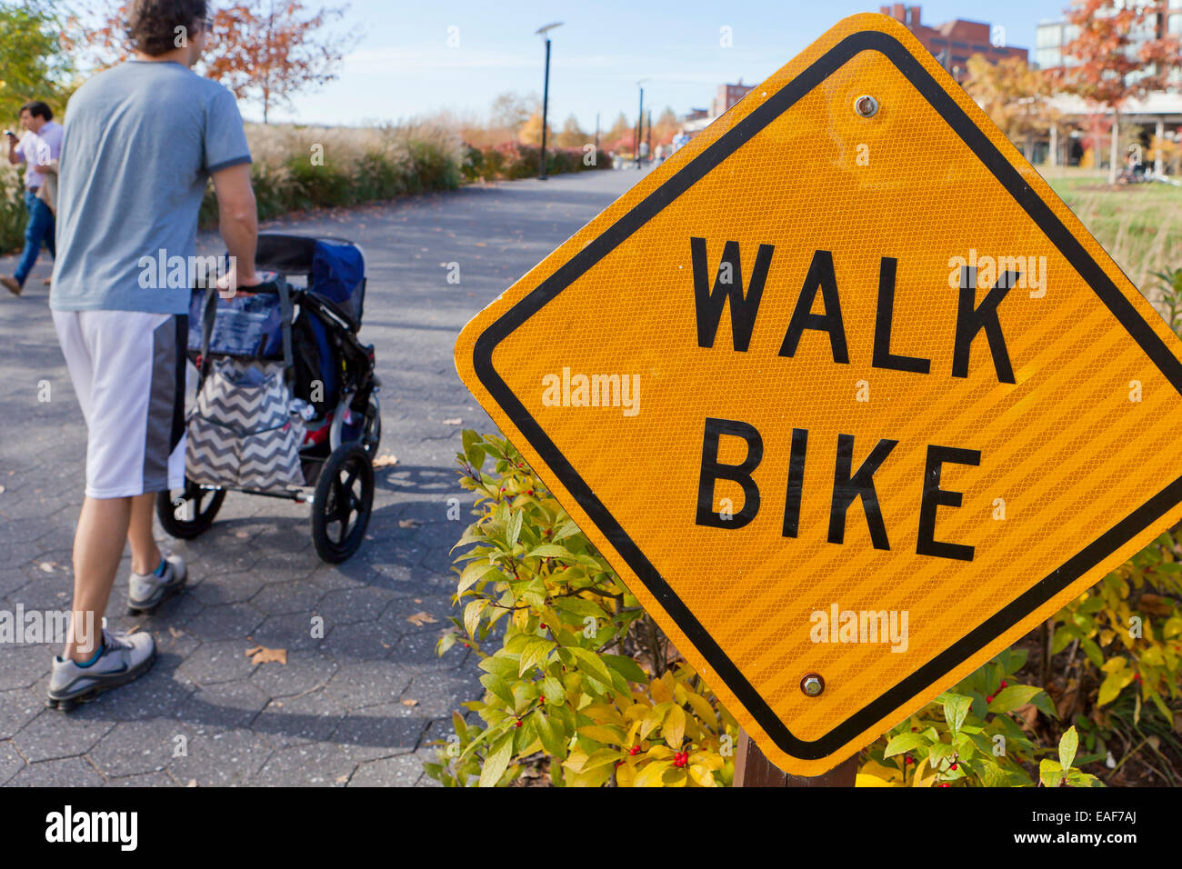 Walk bike sign on pedestrian walkway - USA Stock Photo - Alamy