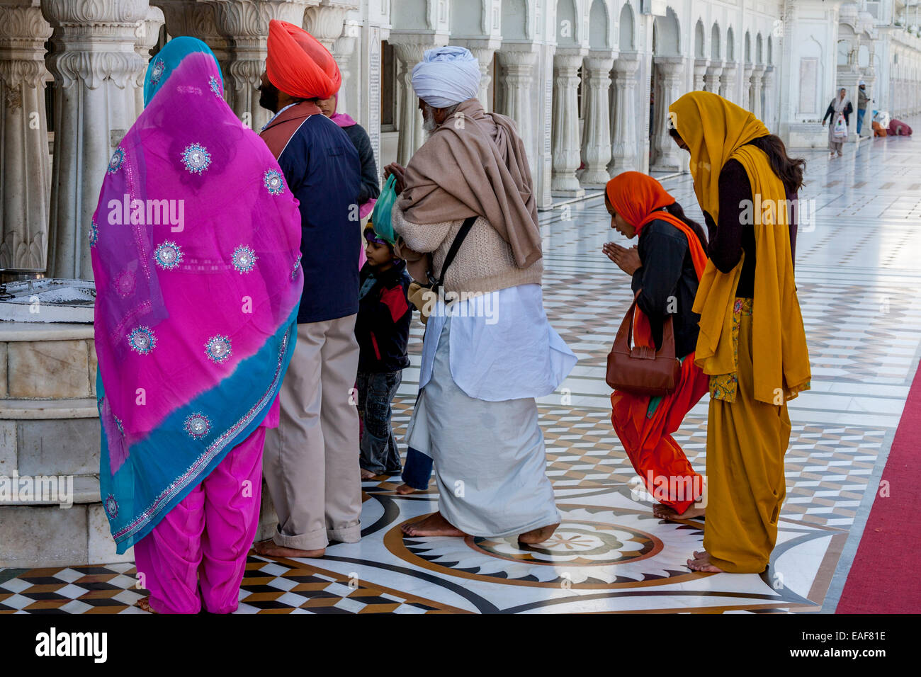 Sikhs Praying At The Golden Temple of Amritsar, Punjab, India Stock ...