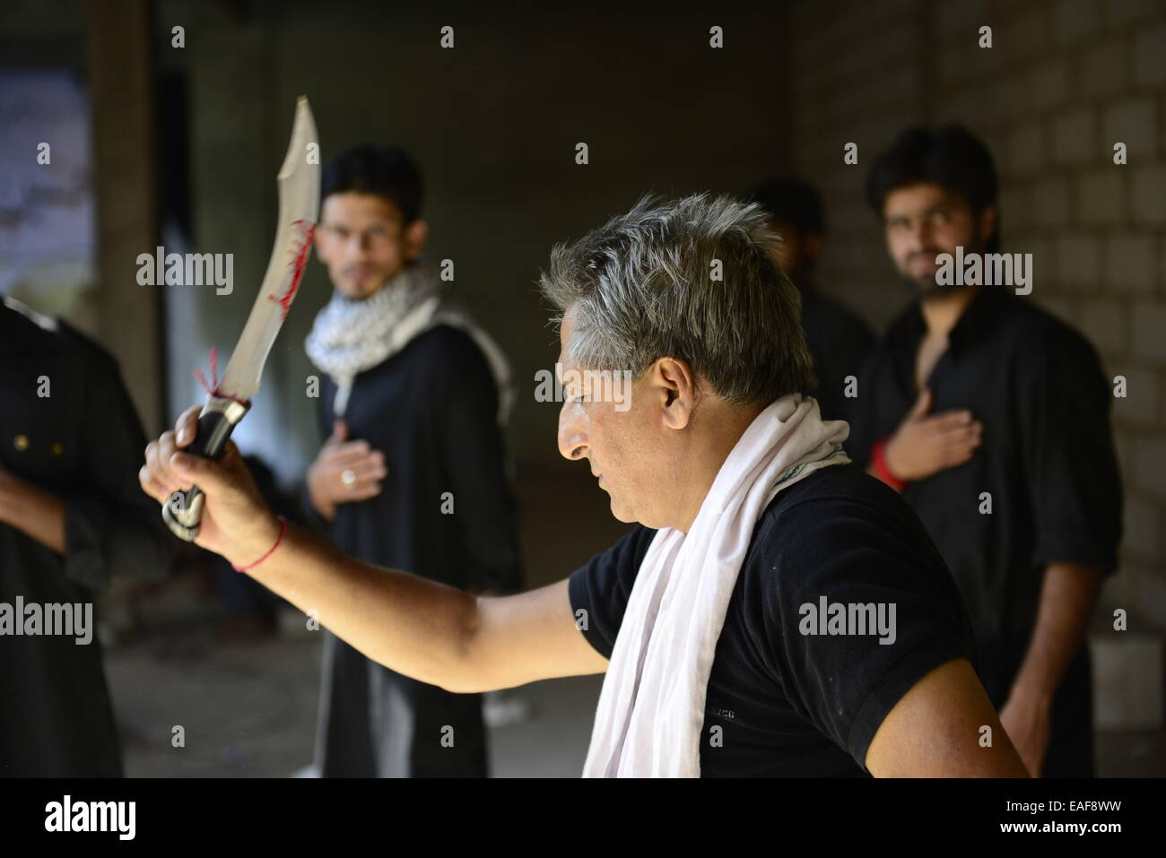 A Shia man cutting his head during the Ashura festival Stock Photo - Alamy