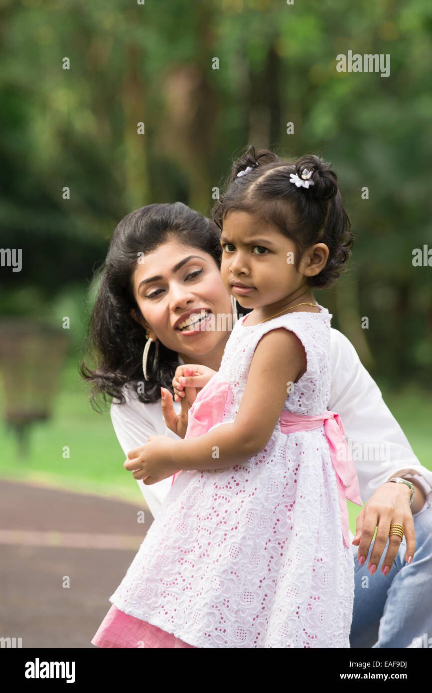 Happy Indian Mother And Daughter Playing In The Park Lifestyle Image