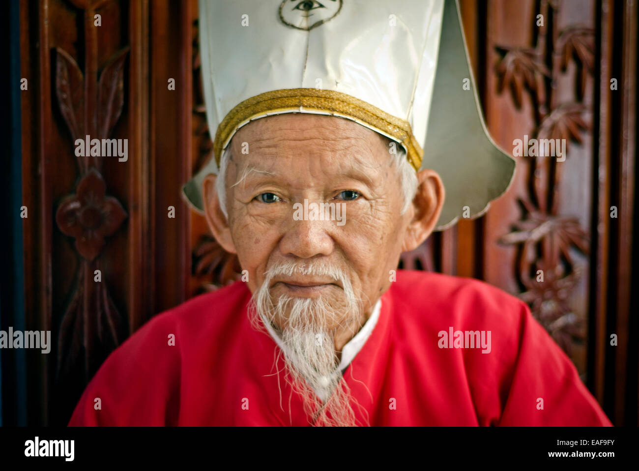 High priest posing for photo,Cao Dai temple ,Tay Ninh ,Vietnam Stock ...
