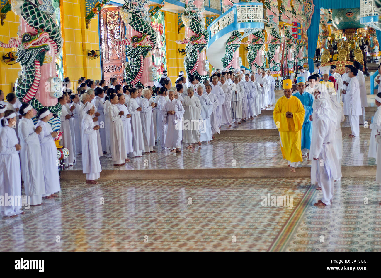 Priests leaving the temple after 12 o'clock ritual,Cao Dai temple ,Tay ...