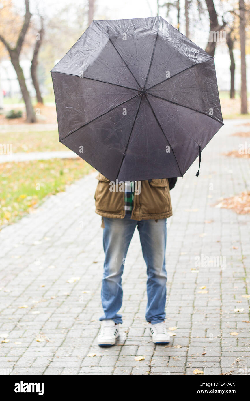 Man holding Umbrella Stock Photo - Alamy