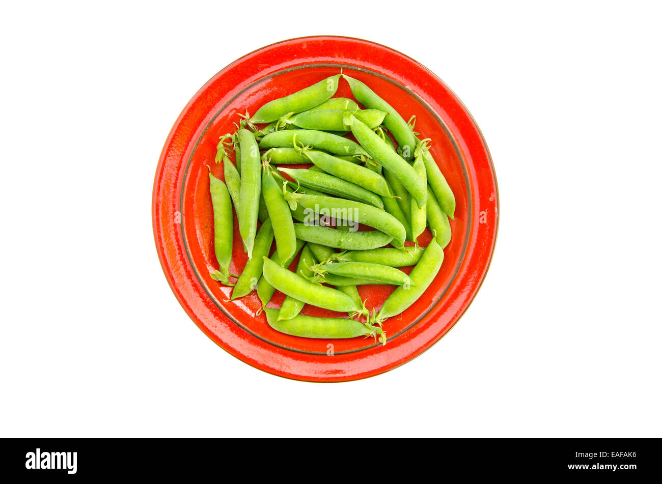 fresh pea pods in red ceramic plate isolated on white Stock Photo - Alamy