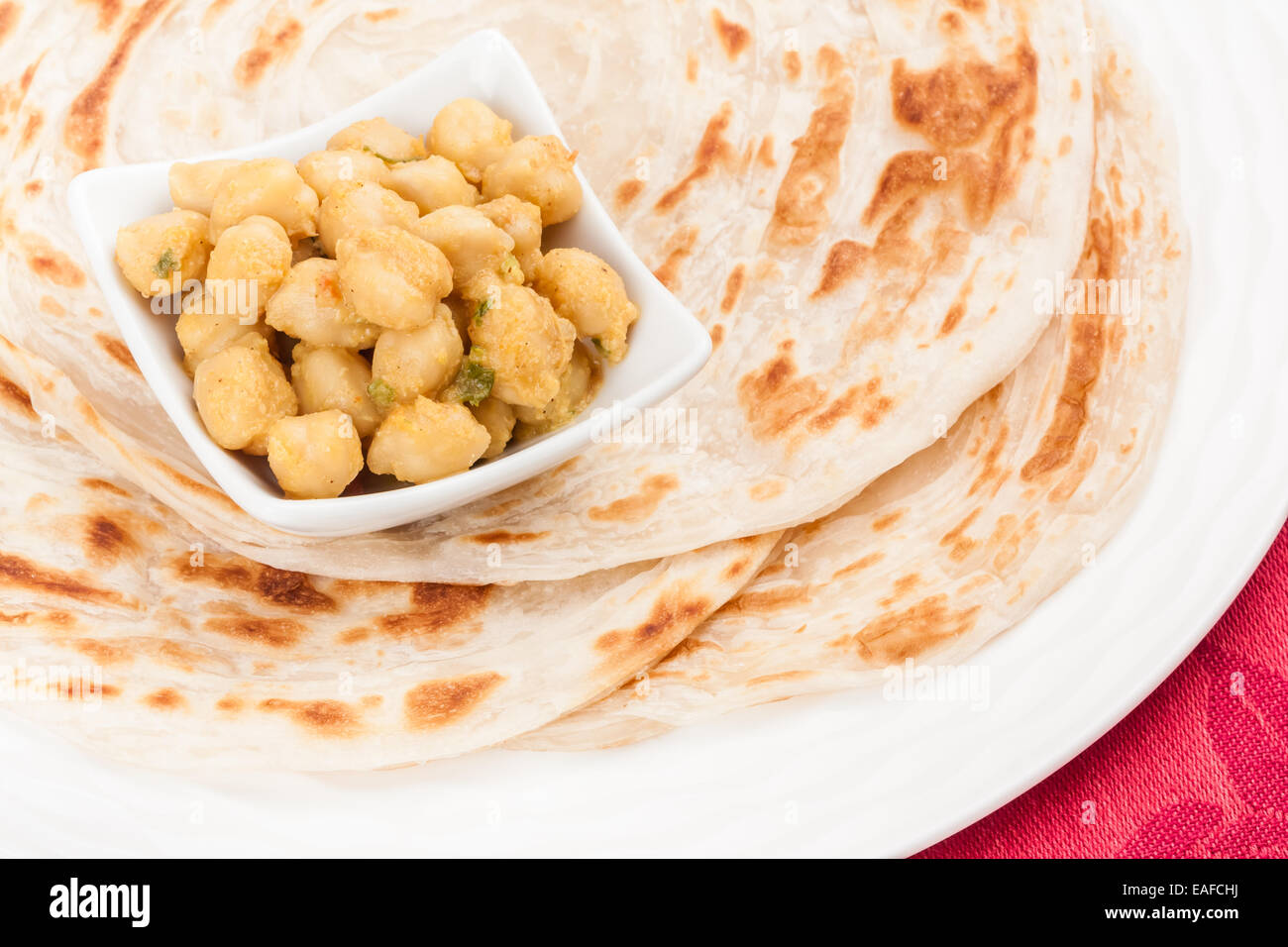 Homemade parotta (Indian bread) served with delicious Indian chana ...