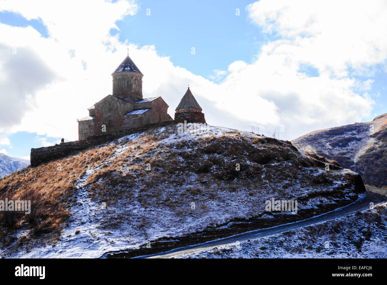 Gergeti Trinity Church is on the Mount Kazbek in eastern Georgia Stock ...