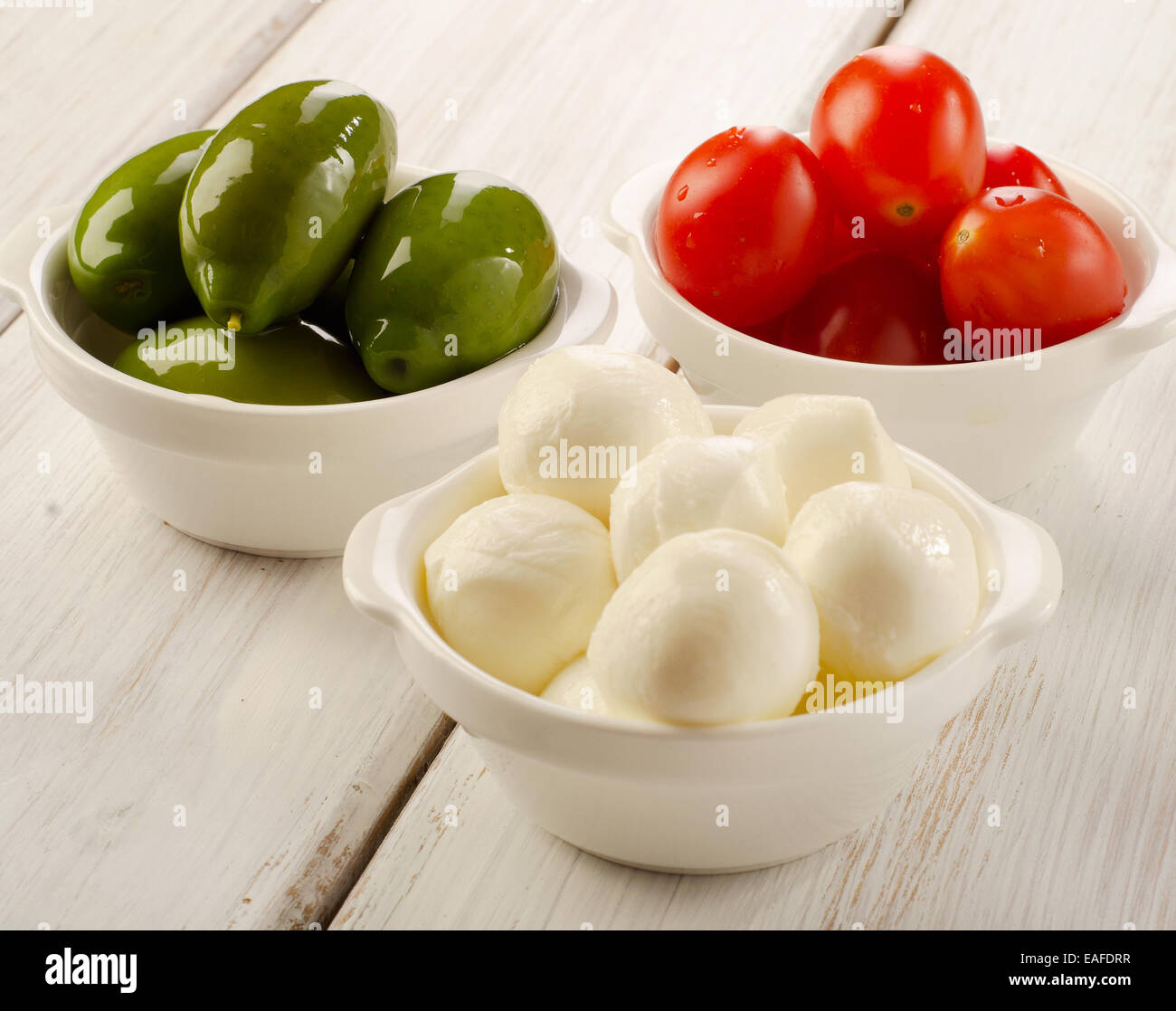 fresh mozzarella , tomatoes and green olives . selective focus Stock ...