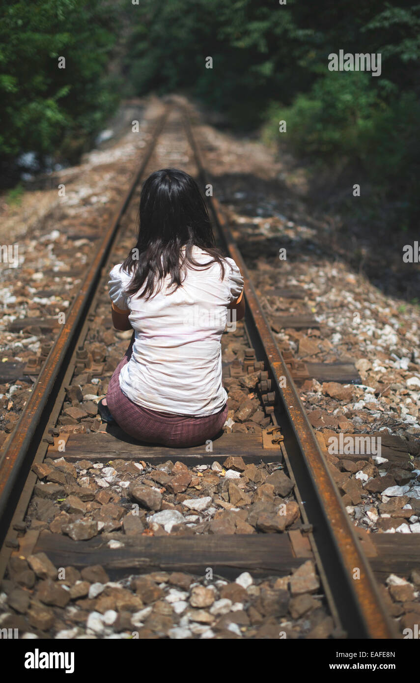 Women sitting on railroad Stock Photo - Alamy