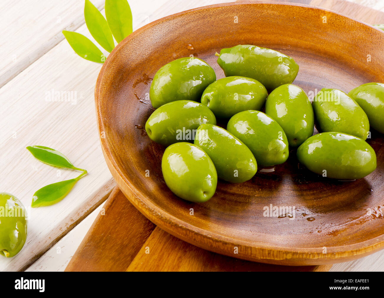 Group olives on wooden hi-res stock photography and images - Alamy
