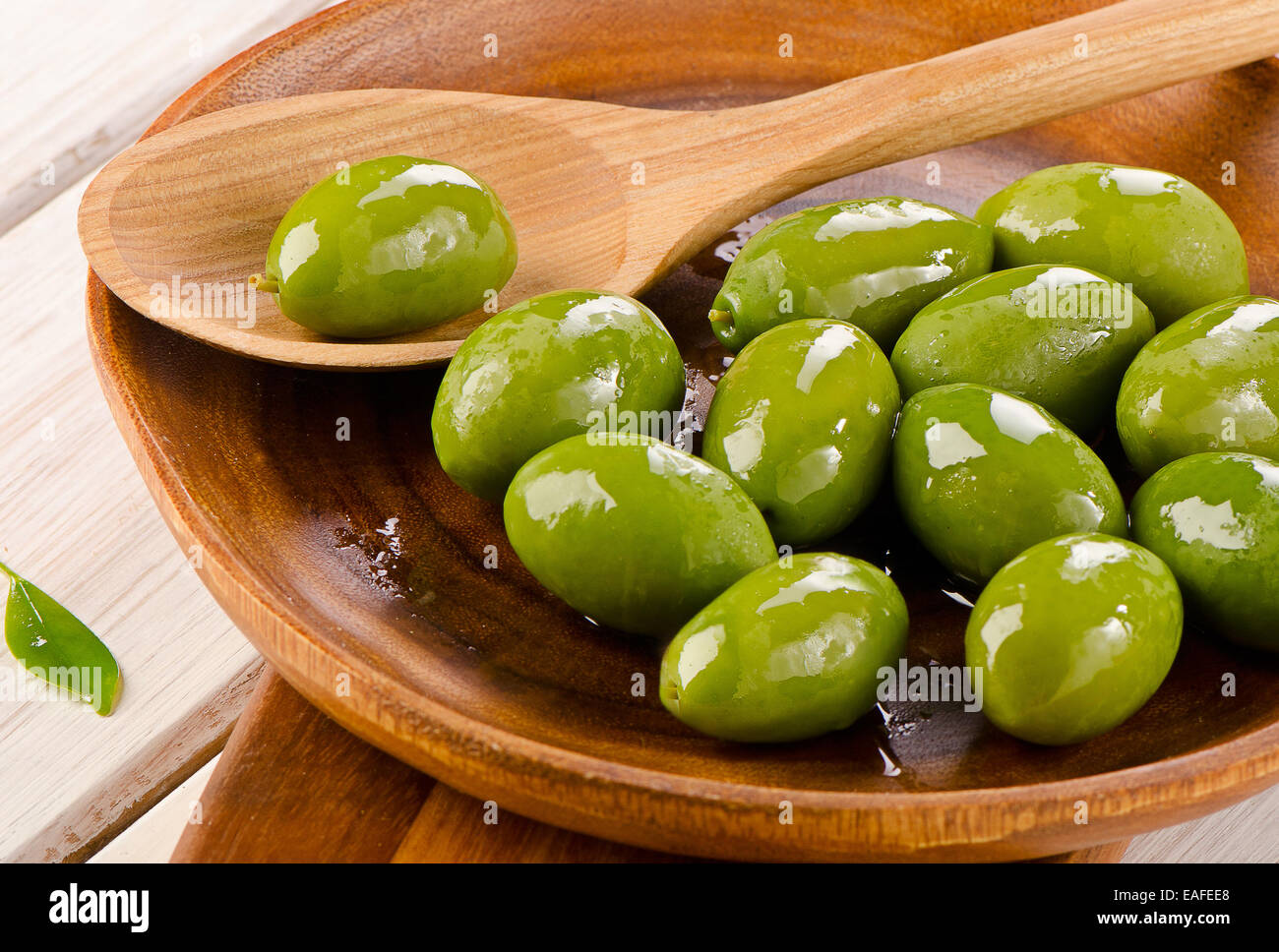 Group olives on wooden hi-res stock photography and images - Alamy