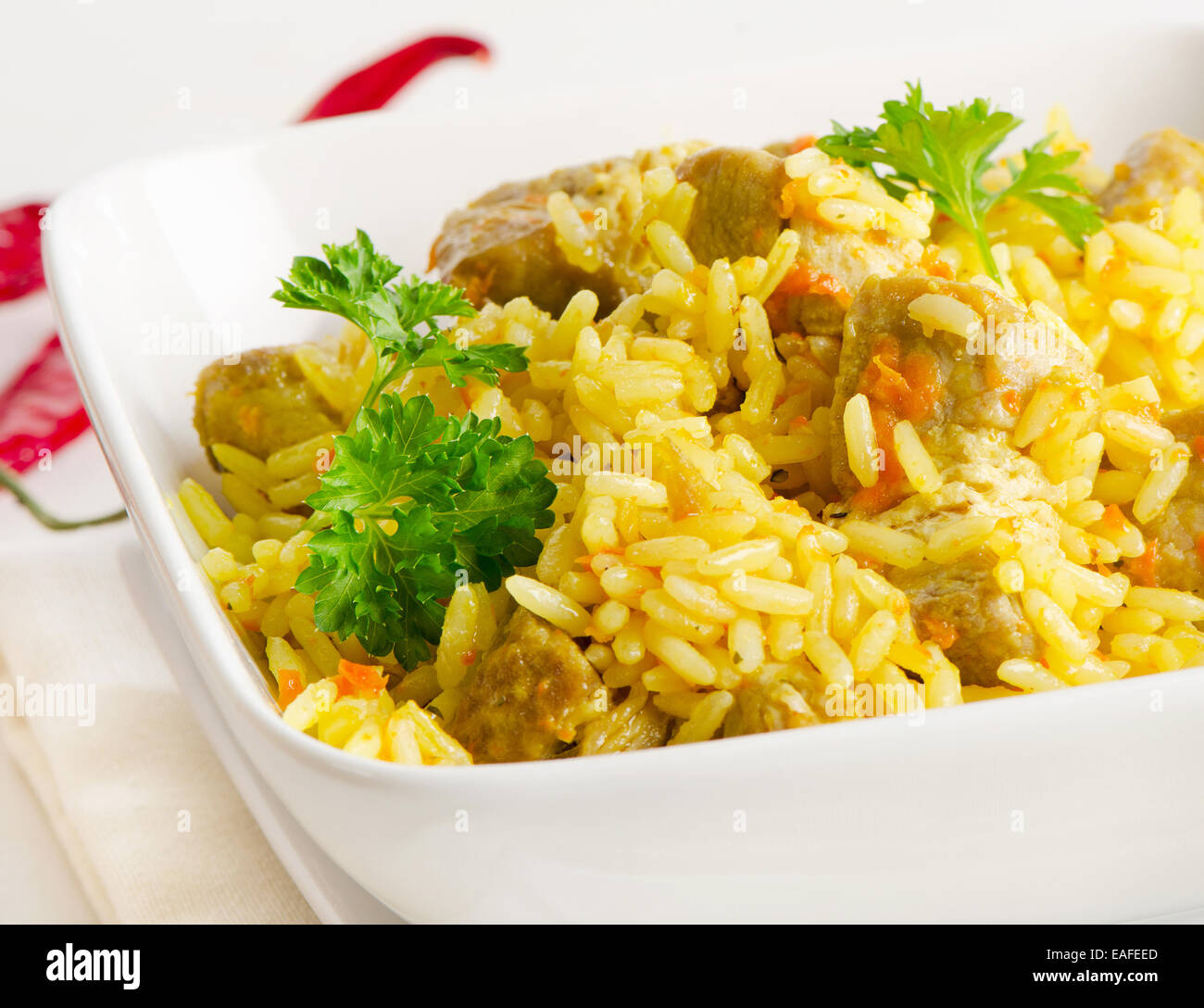 Traditional oriental pilaf in white bowl. Selective focus Stock Photo ...