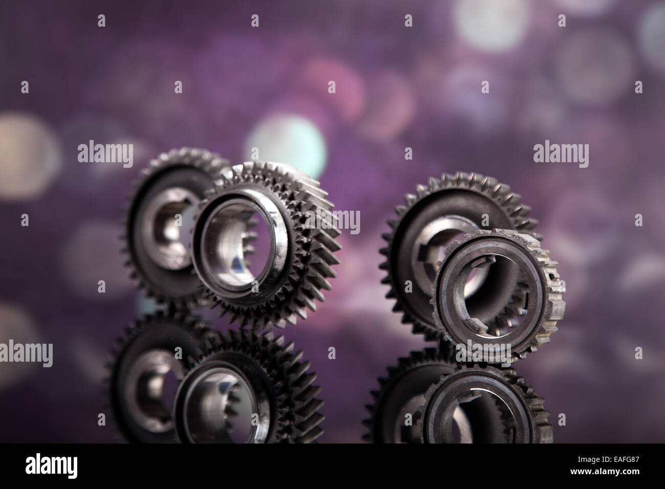 Big metal gears on glossy black background Stock Photo - Alamy