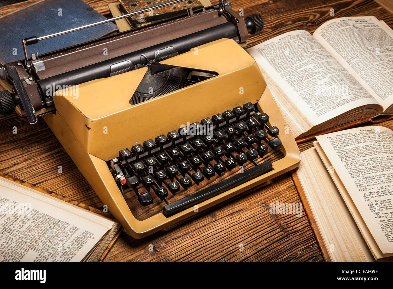 old typewriter, a pile of books and a lot of creativity! Stock Photo ...