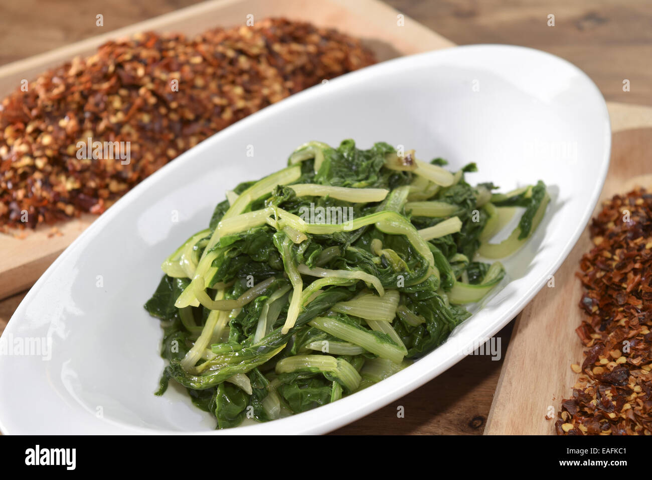 chicory cooked in pan with chilli Stock Photo - Alamy