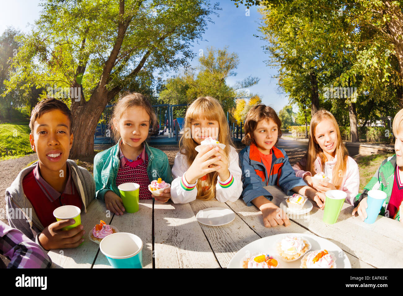 Children diversity drinking tea and eat outside Stock Photo - Alamy