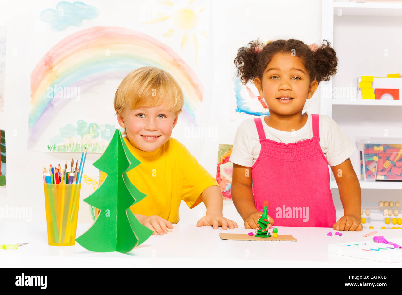 Two happy kids making hi-res stock photography and images - Alamy