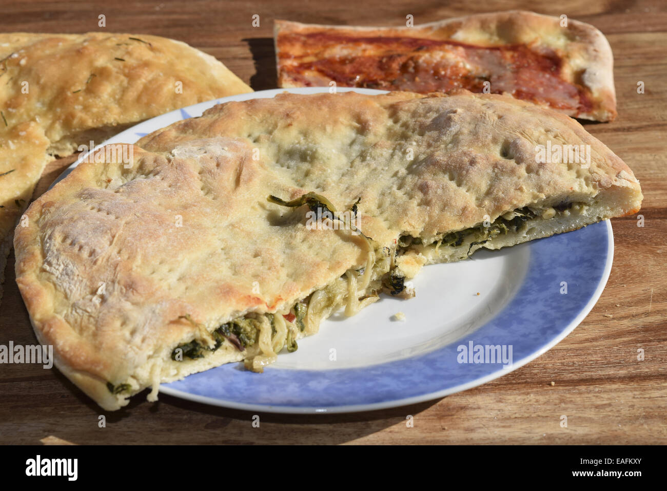 stuffed pizza with escarole and pine nut Stock Photo - Alamy