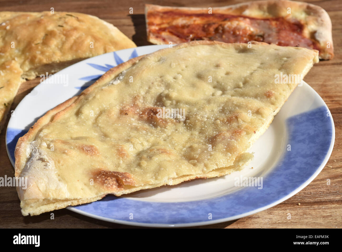 pizza stuffed with mozzarella and ham Stock Photo - Alamy
