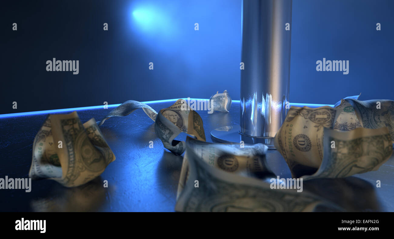 An isolated stripper pole on a stage lit by a single spotlight ...