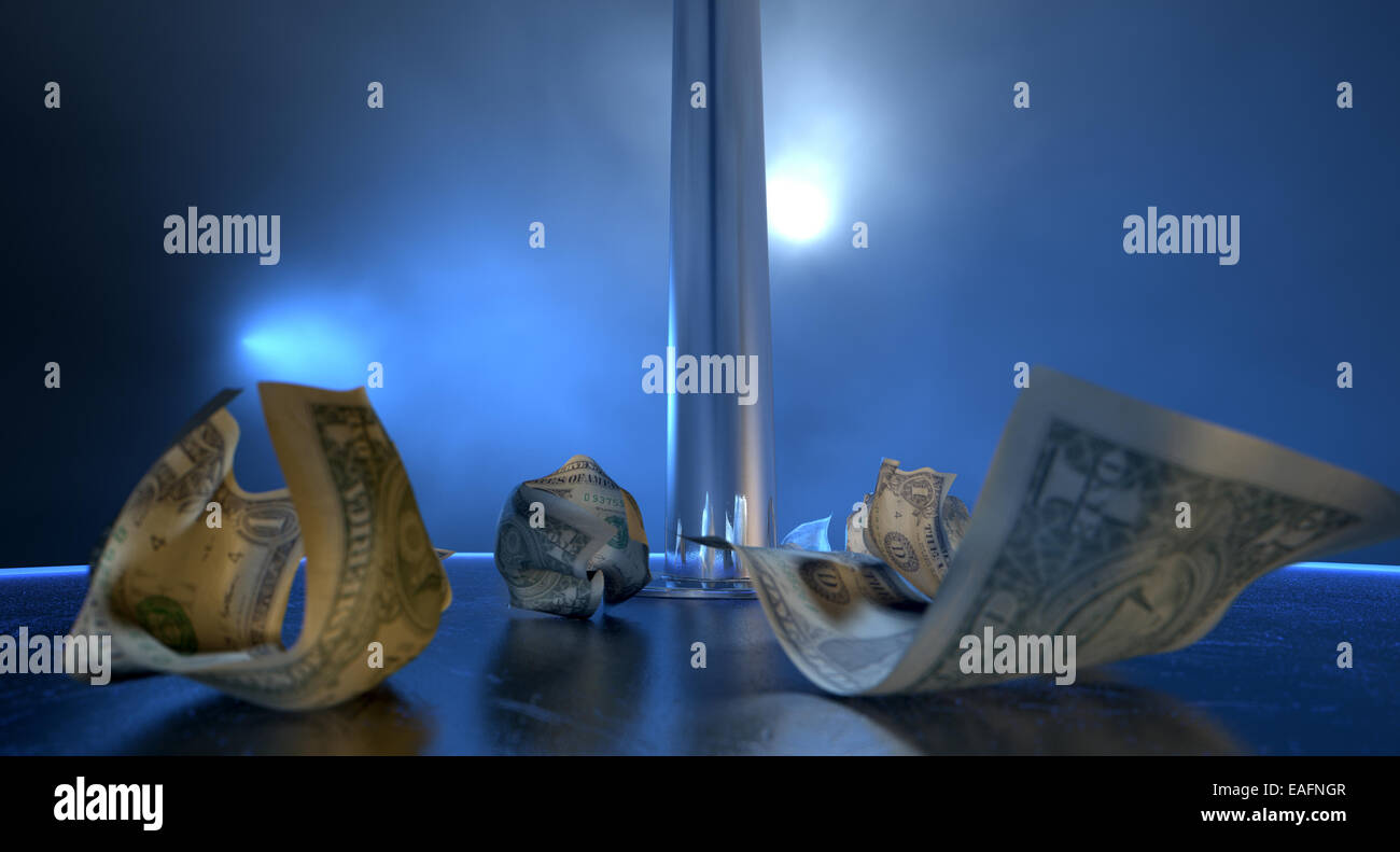 An isolated stripper pole on a stage lit by a single spotlight ...