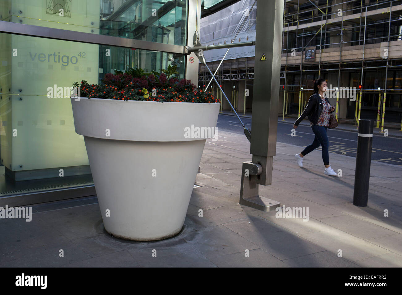 Large scale flower pot outside an office in the City of London, UK ...