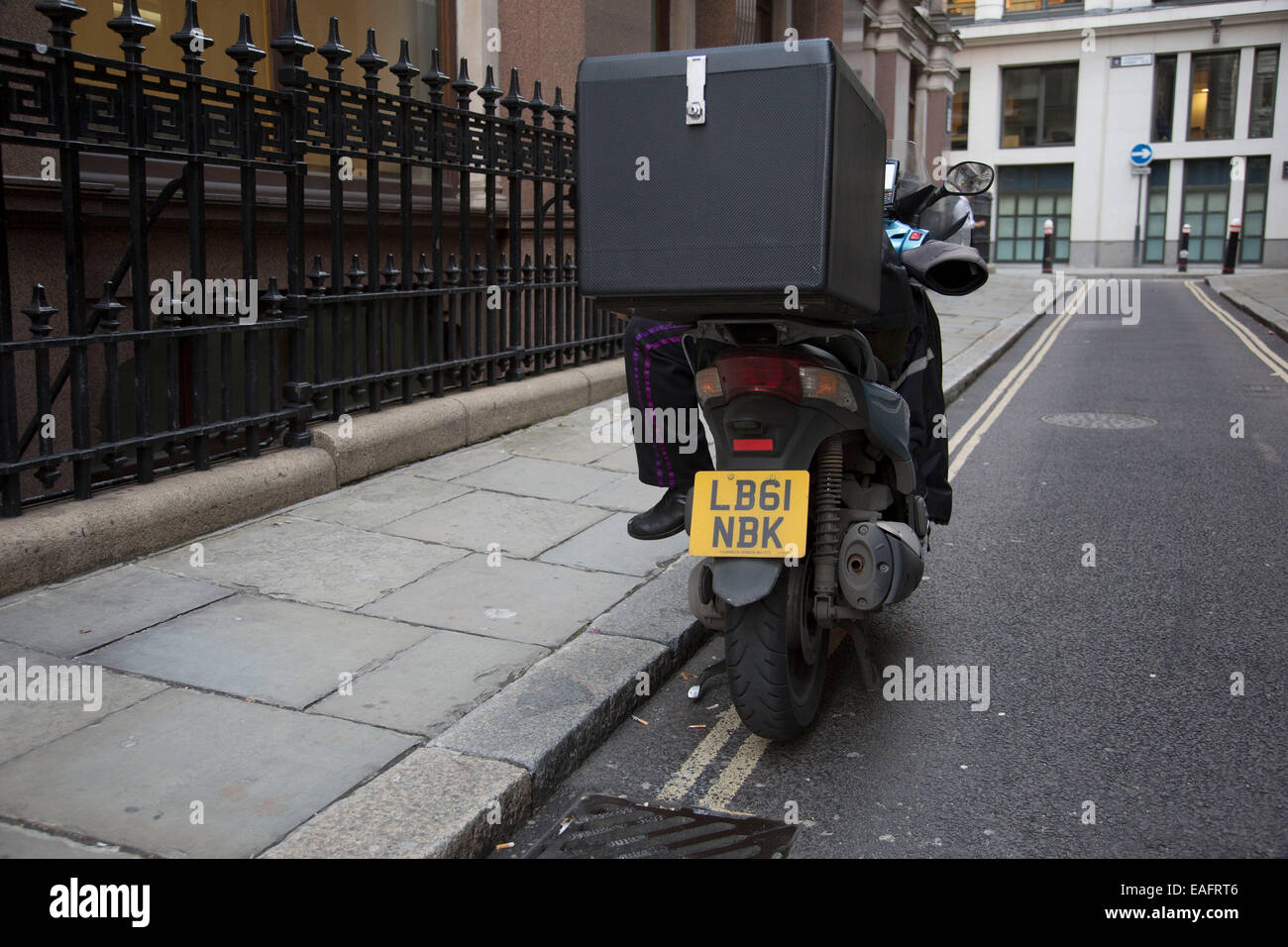 Motorcycle courier who appears to only have one leg. London, UK Stock ...