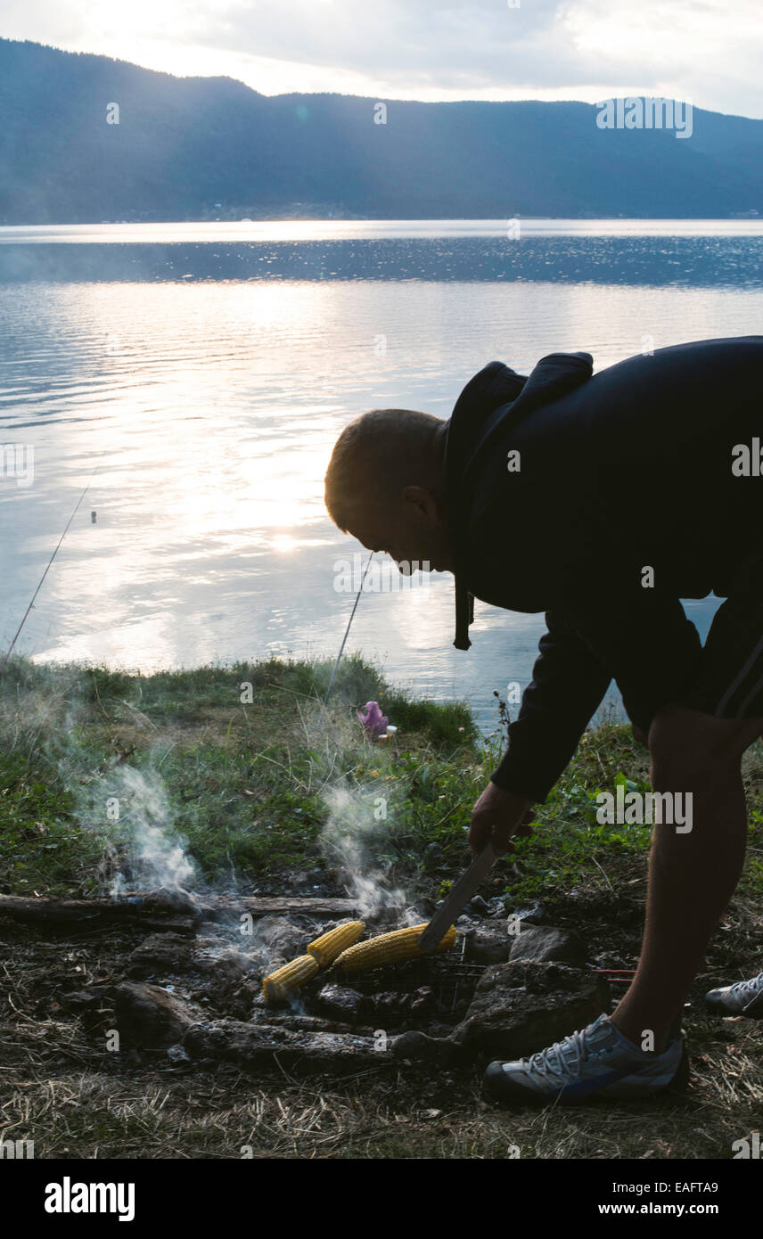 Man in forest making fire hi-res stock photography and images - Alamy