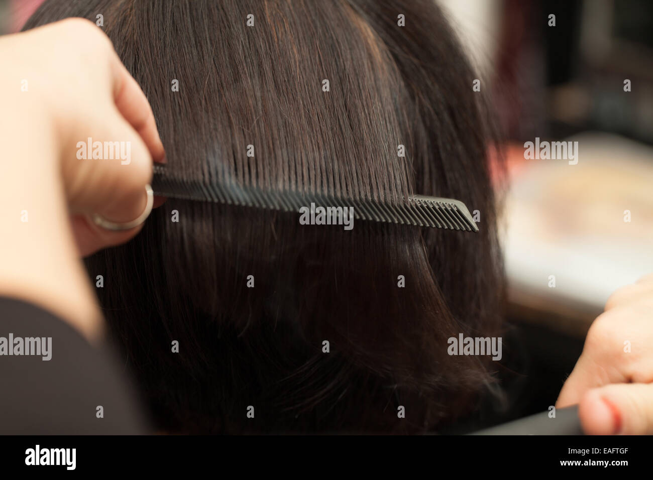 Straightening hair hi-res stock photography and images - Alamy