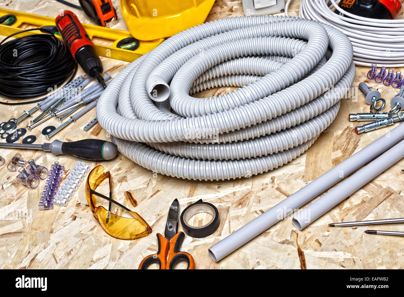 electrician tools on osb wood background Stock Photo - Alamy