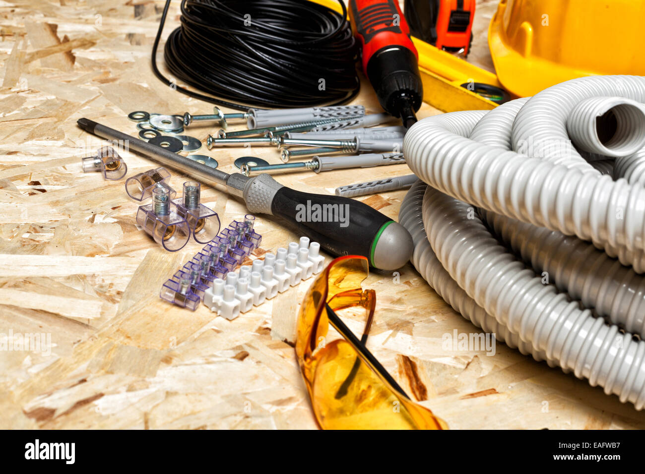 electrician tools on osb wood background Stock Photo - Alamy