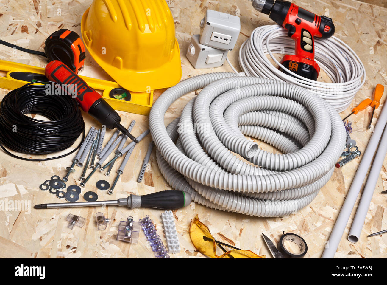 electrician tools on osb wood background Stock Photo - Alamy