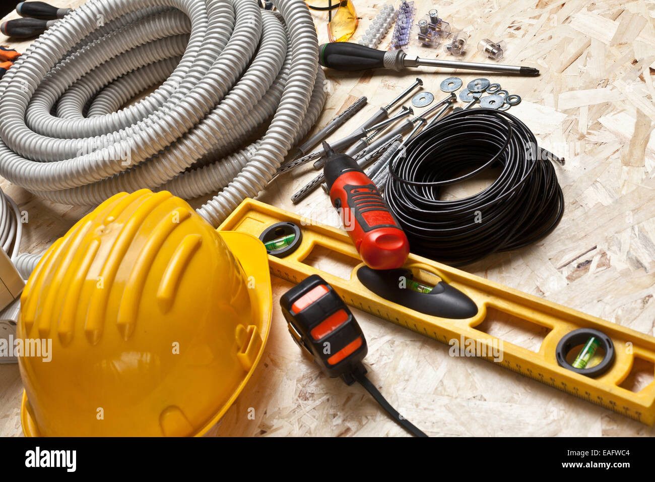 electrician tools on osb wood background Stock Photo - Alamy