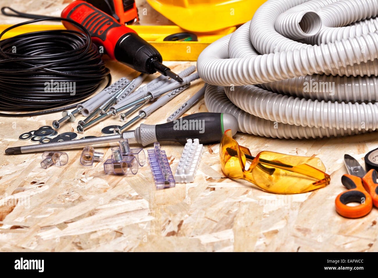 electrician tools on osb wood background Stock Photo - Alamy