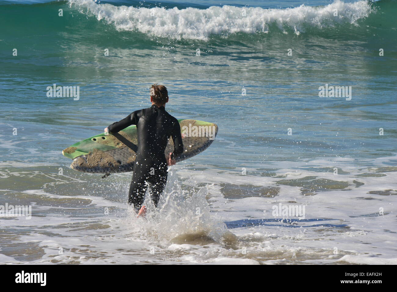 Surfing at Zuma beach California Stock Photo - Alamy