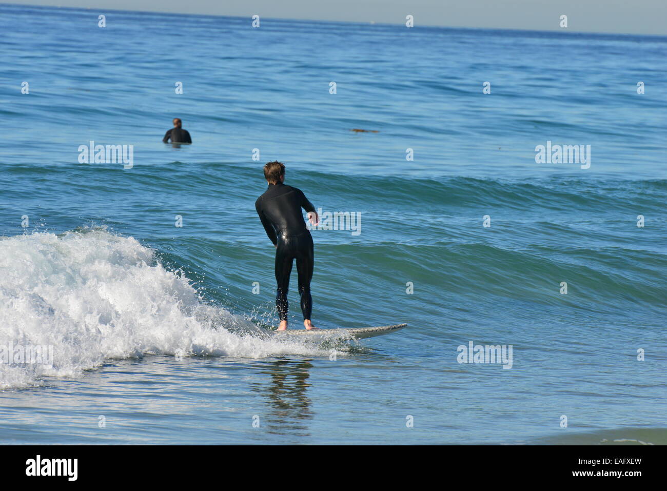 Surfing at Zuma beach California Stock Photo - Alamy