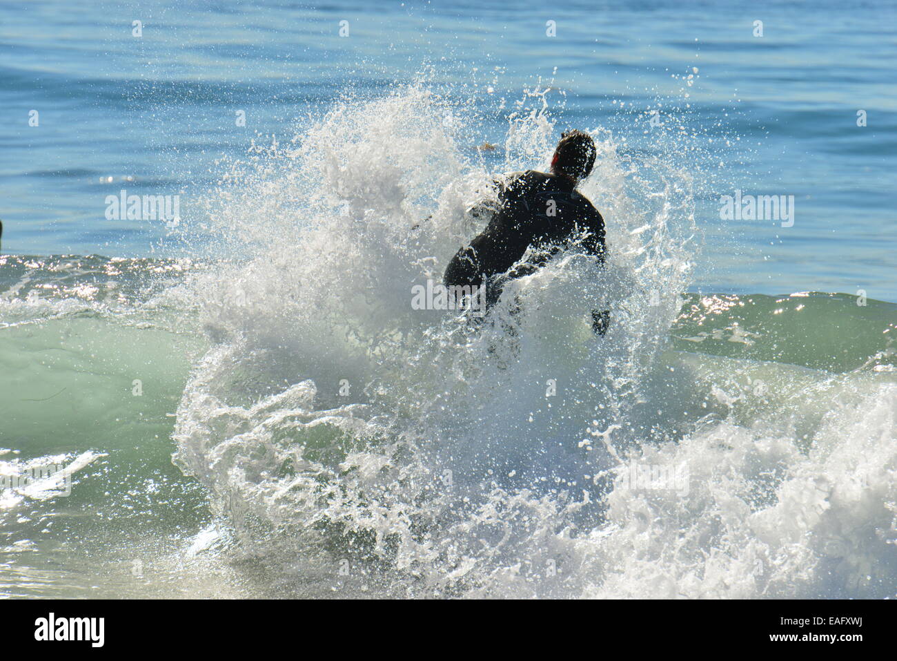 Surfing at Zuma beach California Stock Photo - Alamy