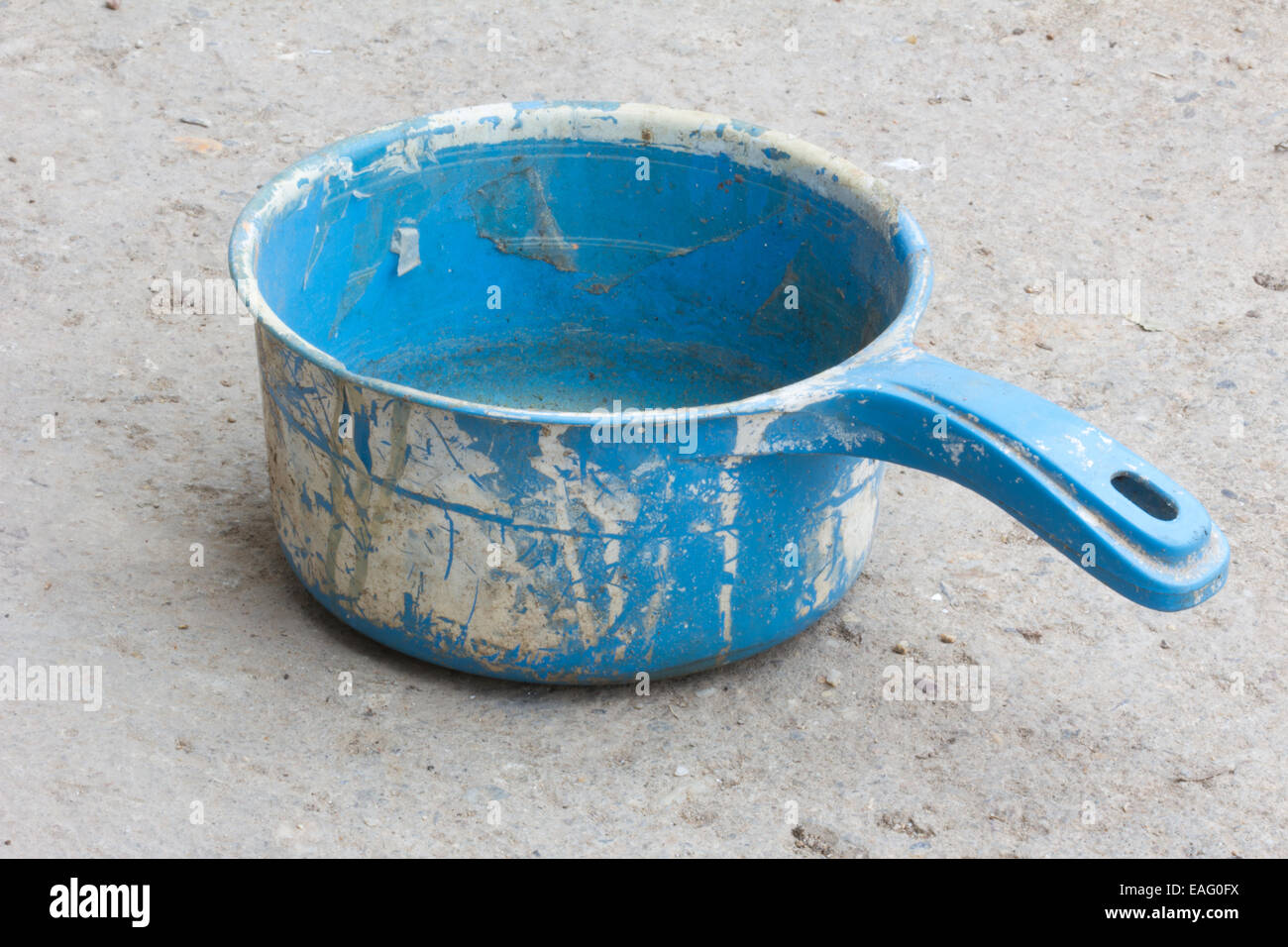 old blue water dipper on the floor Stock Photo - Alamy