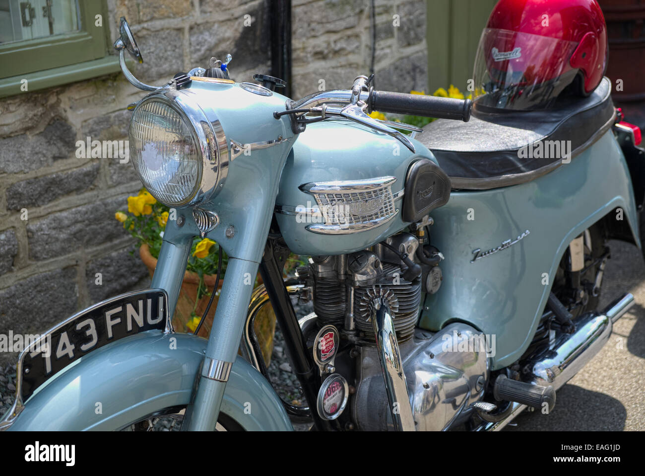 Classic Triumph motorcycle in Castelton Derbyshire England Stock Photo ...