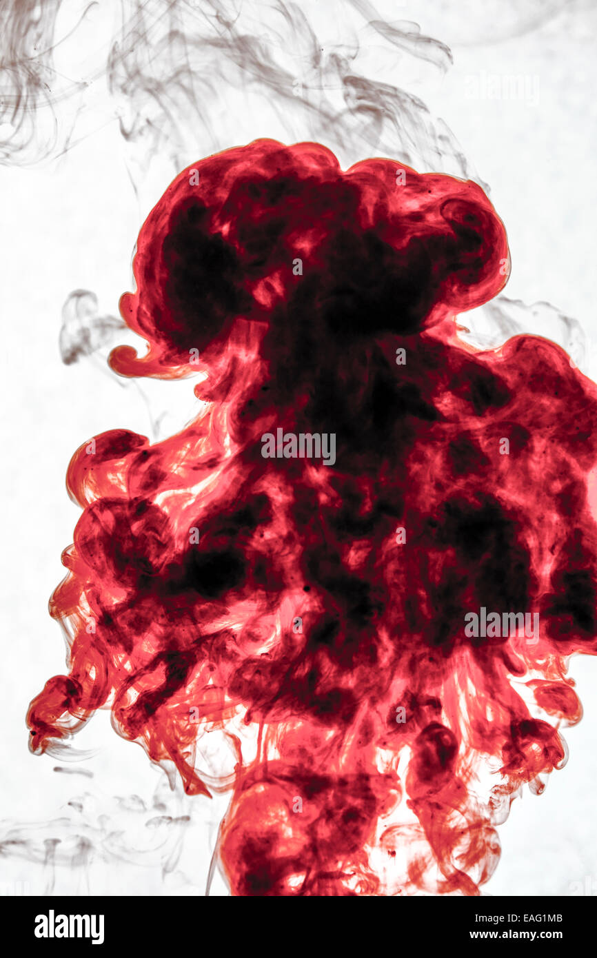 Red coloured dye in water Stock Photo - Alamy