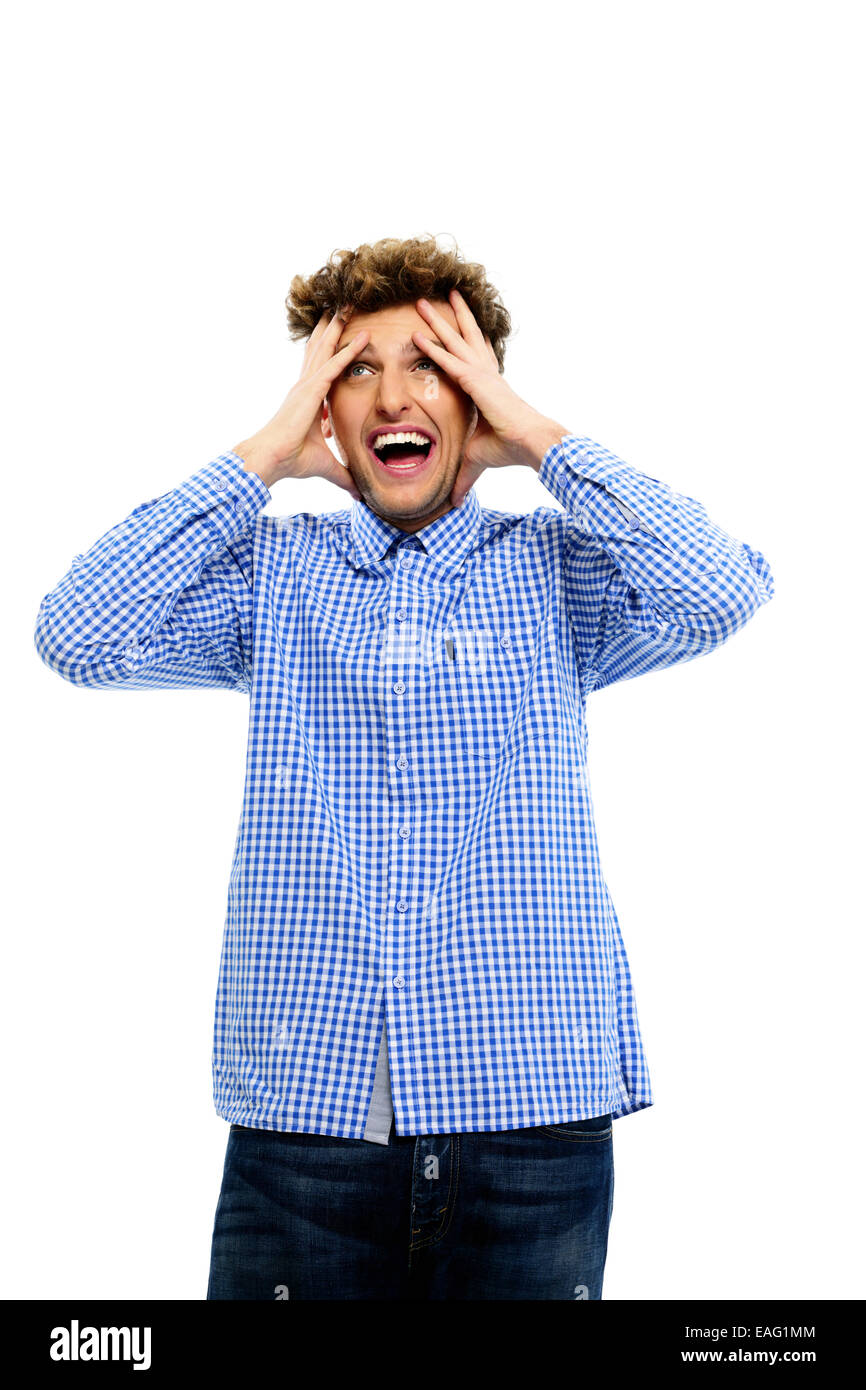 Portrait of crazy young man standing on a white background Stock Photo ...