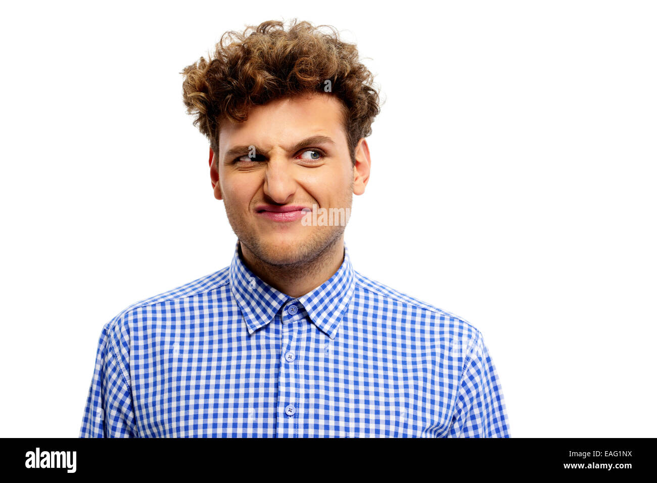 Young man with displeased facial expression Stock Photo - Alamy