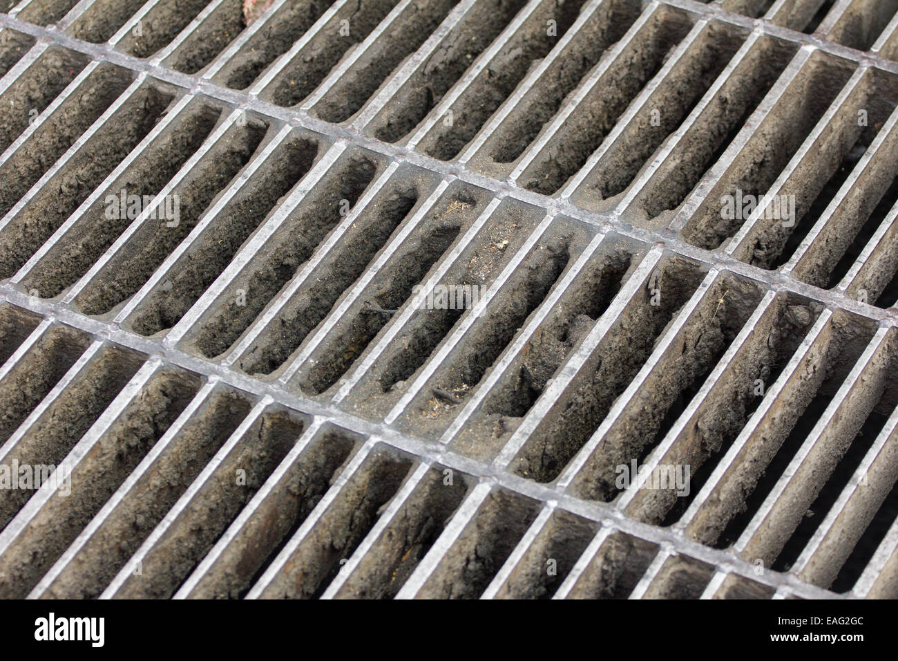 Drain grating on road in Thailand, background Stock Photo - Alamy