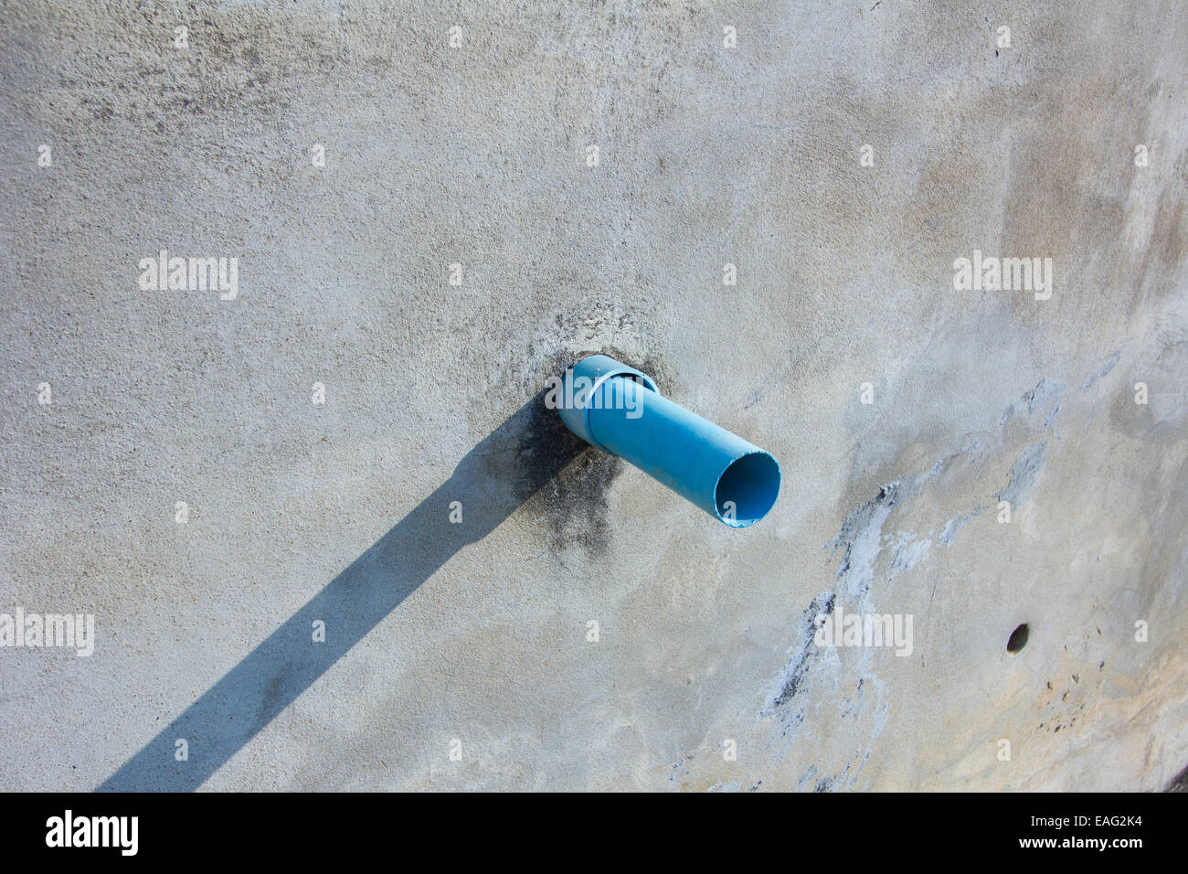 waste pipe on a wall in sunshine Stock Photo - Alamy