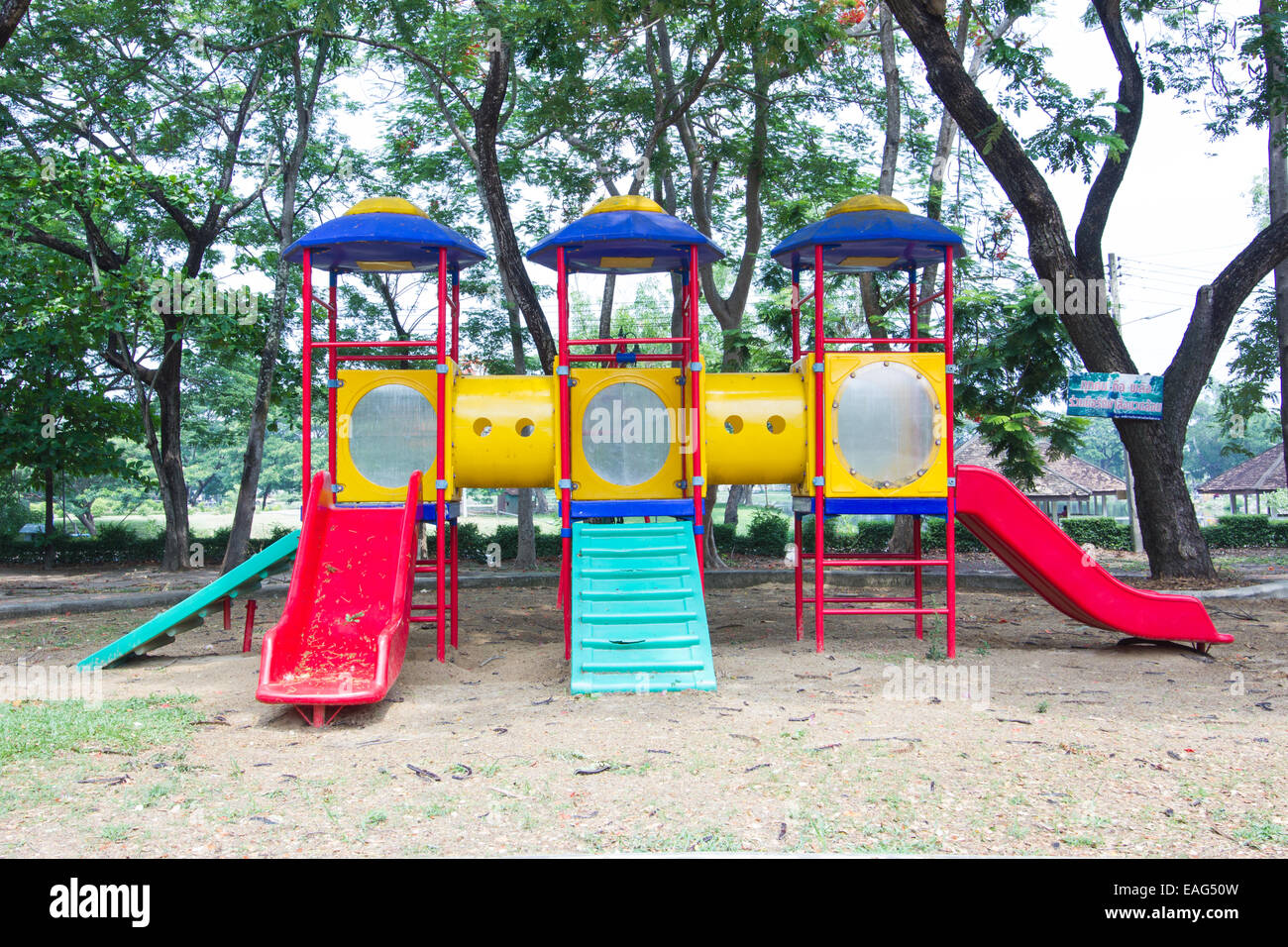 Playground without children in a park Stock Photo - Alamy