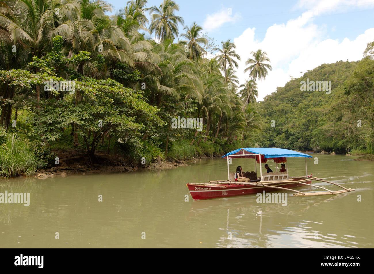 Traditional Philippine boat bangca (outrigger canoe) floats on the ...