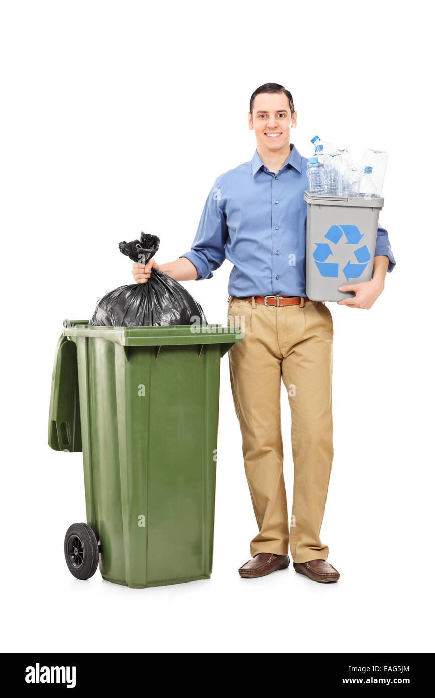 Full length portrait of a man holding a recycle bin by a trash can ...