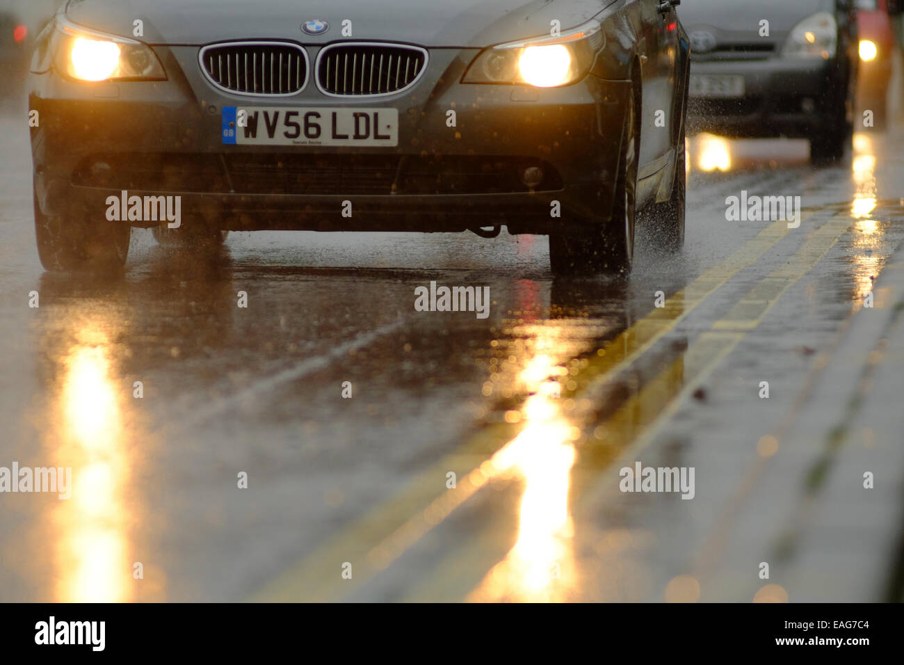 Cars driving in heavy rain on a wet road Stock Photo - Alamy