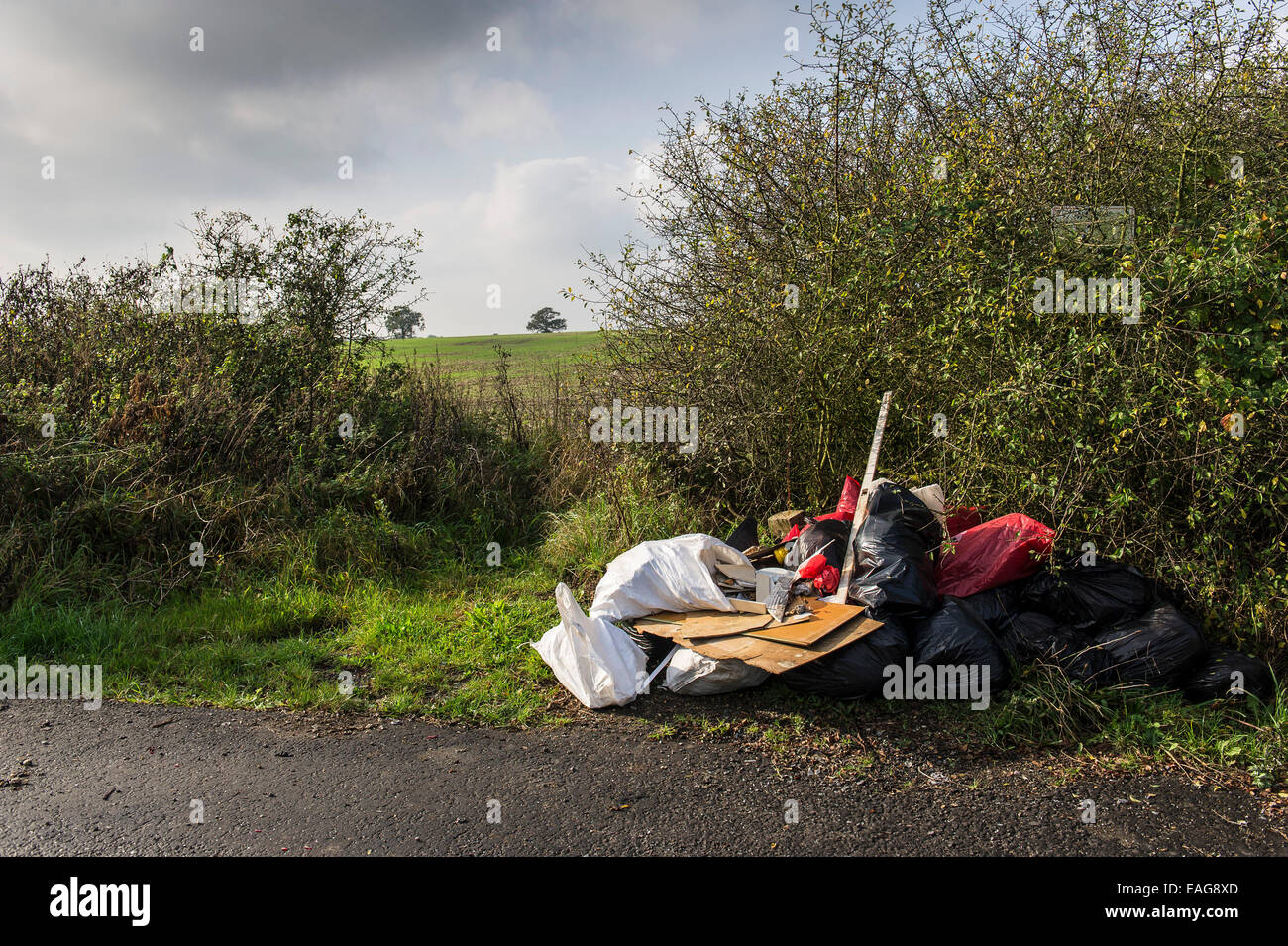 Fly tipping in a layby on a rural road in Essex Stock Photo - Alamy