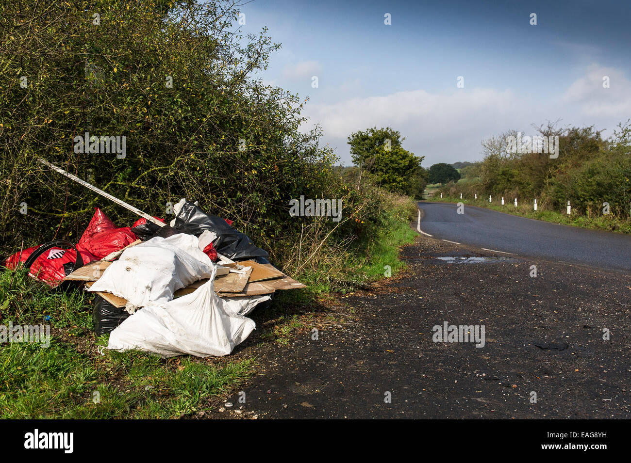 Fly tipping in a lay-by on a road in Essex Stock Photo - Alamy